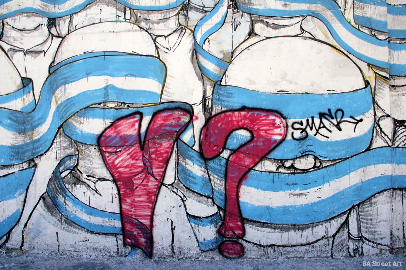 Controversial mural by Blu in Buenos Aires vandalized with graffiti ...
